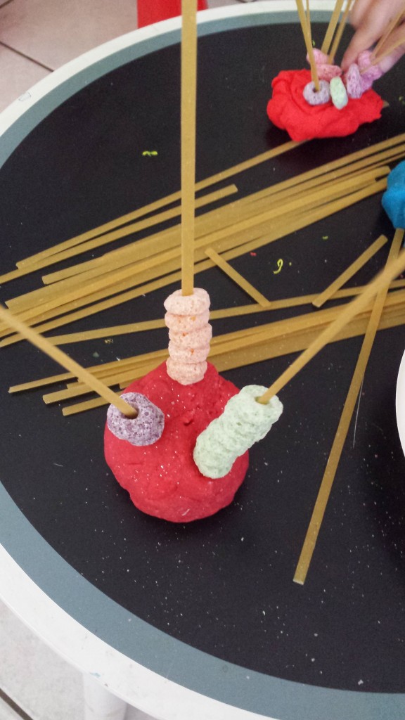 Play Dough spaghetti and cheerios fine motor activity - My Bored Toddler