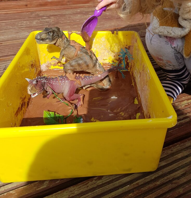hebe dinosaurs in mud - My Bored Toddler