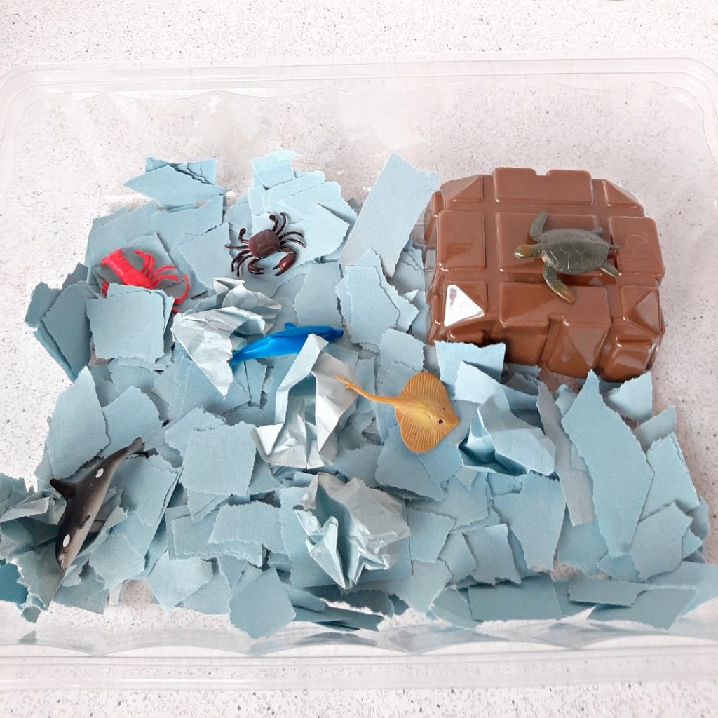 Sensory Bin with Torn Paper - My Bored Toddler