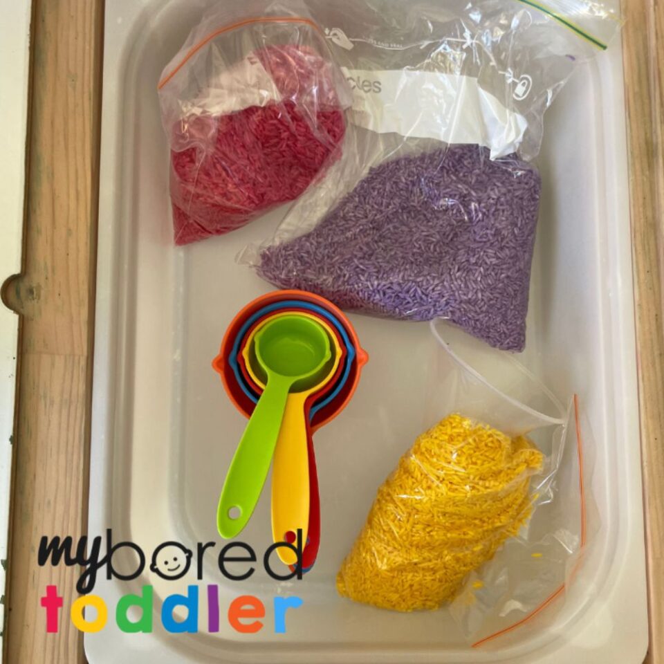 Coloured Rice Pouring Station - My Bored Toddler Fun and Easy Setup!